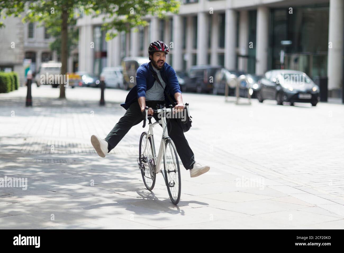 Indian man riding bicycle hi-res stock photography and images - Alamy