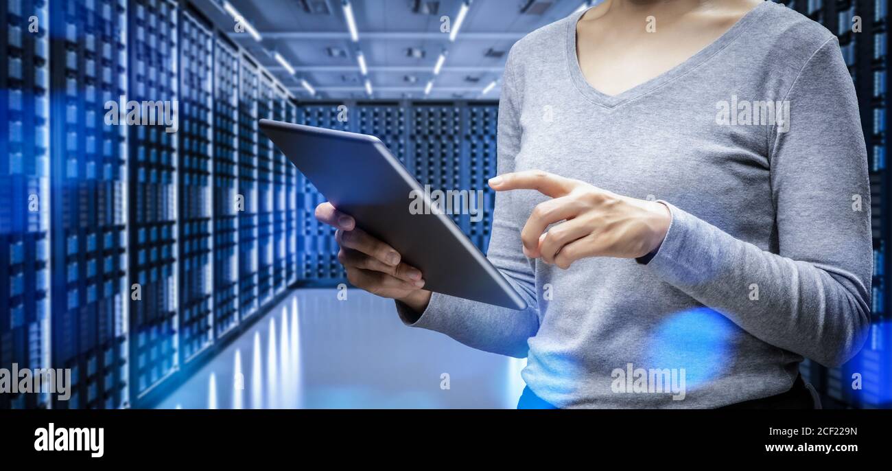 Female programmer with digital tablet in server room Stock Photo - Alamy