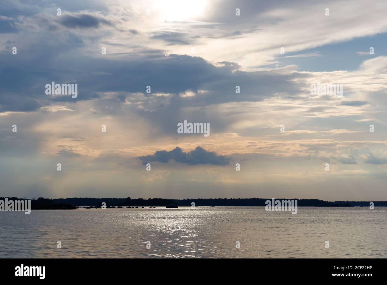 beautiful evening sky with clouds over the lake at sunset Stock Photo ...