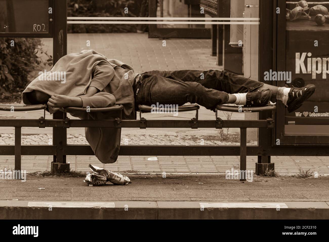 A drunk man sleeps in a tram station, a homeless man sleeps in a tram ... A drunk man sleeps in a tram station, a homeless man sleeps in a tram ...