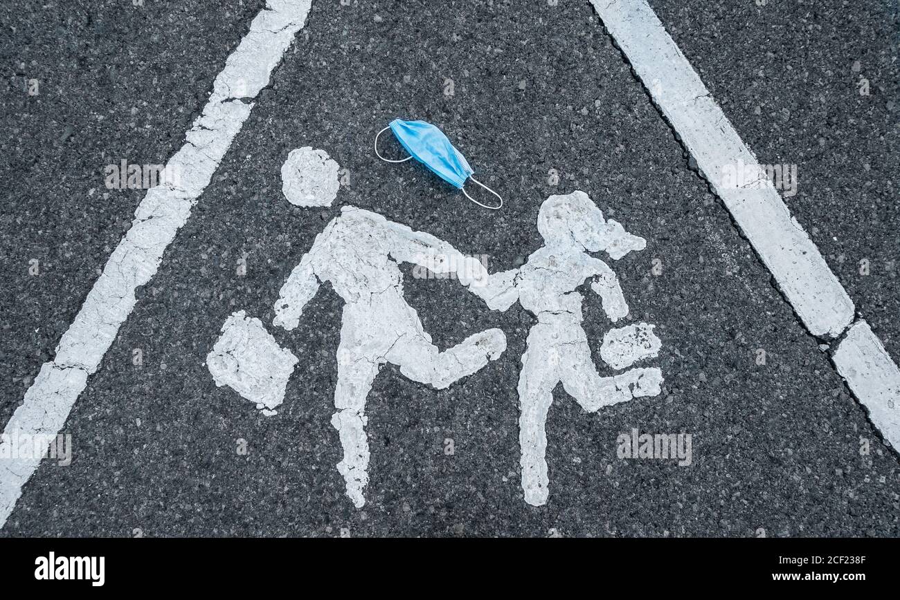 Face mask on road marking outside school. Schoolchildren, face mask ...