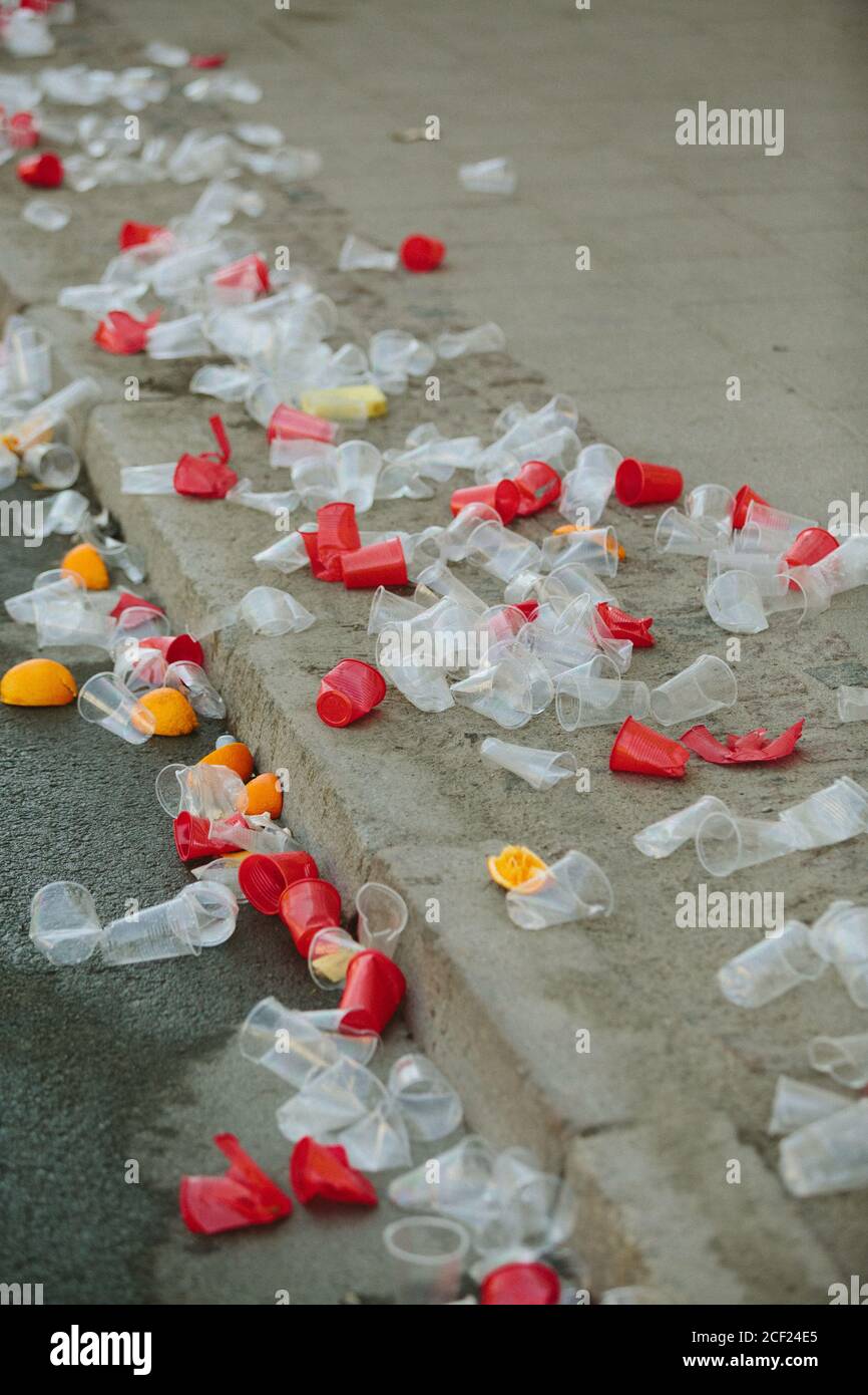 Lot of plastic cups thrown on a street - plastic pollution concept ...