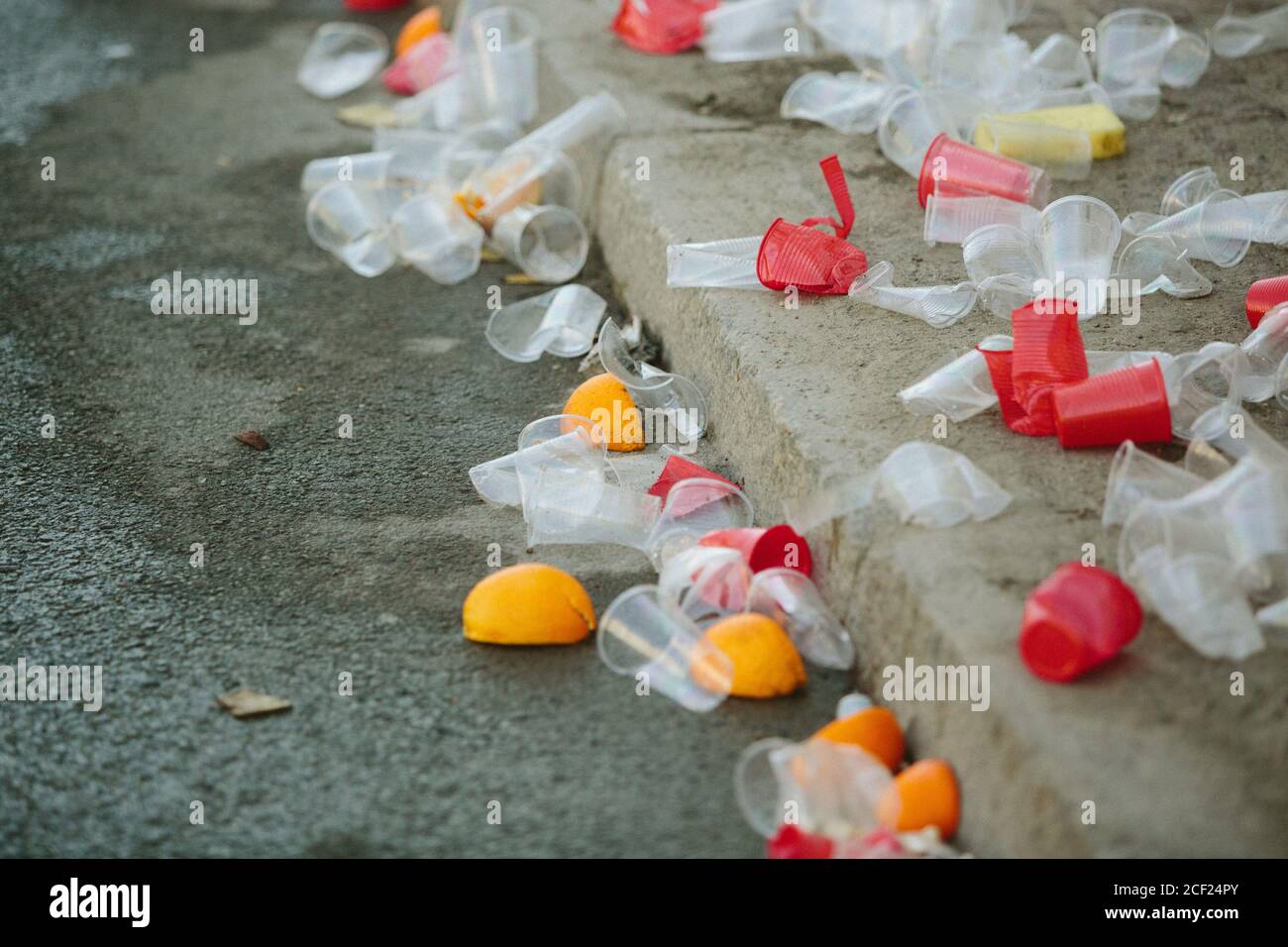 Lot of plastic cups thrown on a street - plastic pollution concept ...