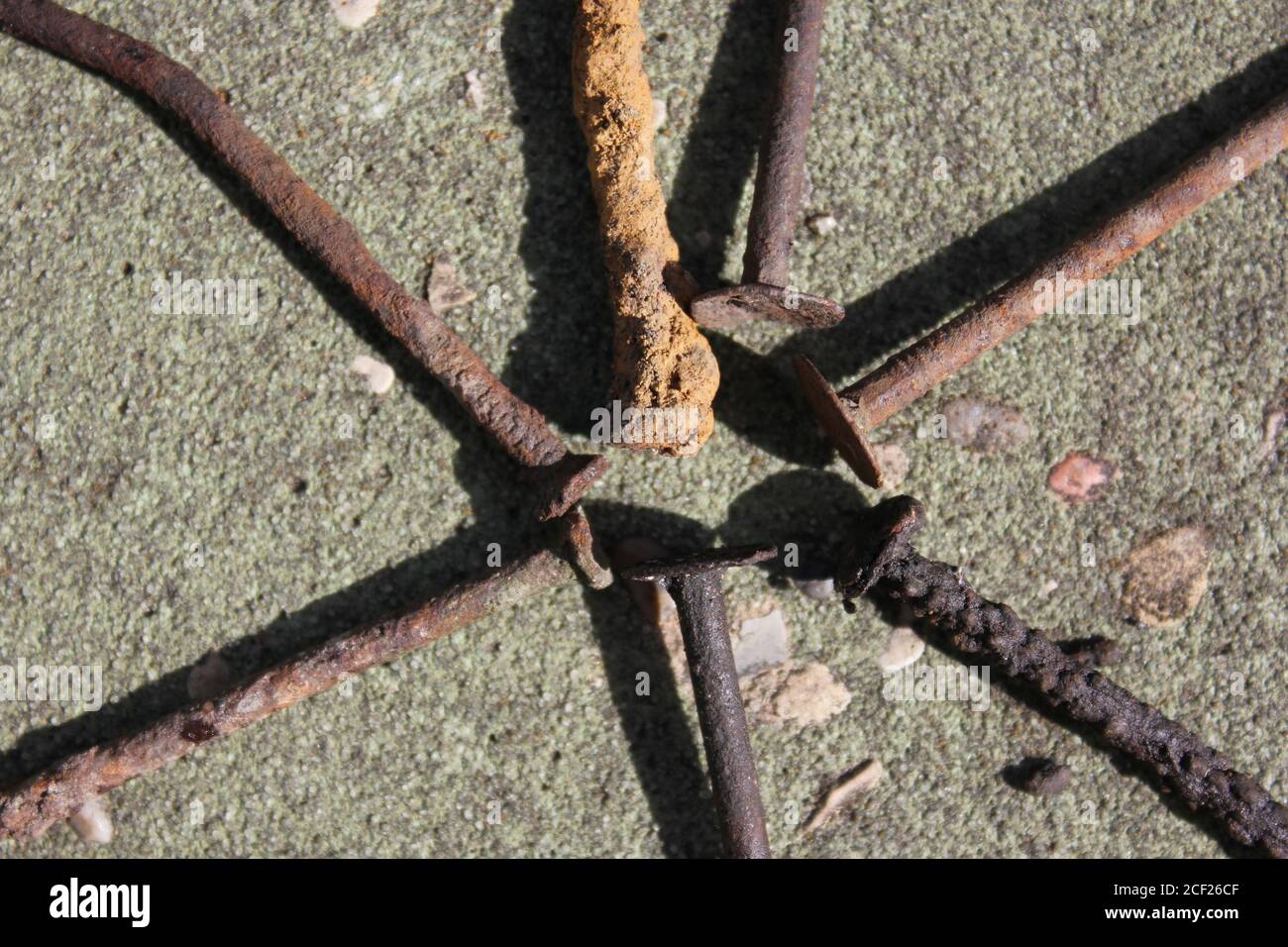 A pile of rusted nails laying on the ground Stock Photo - Alamy