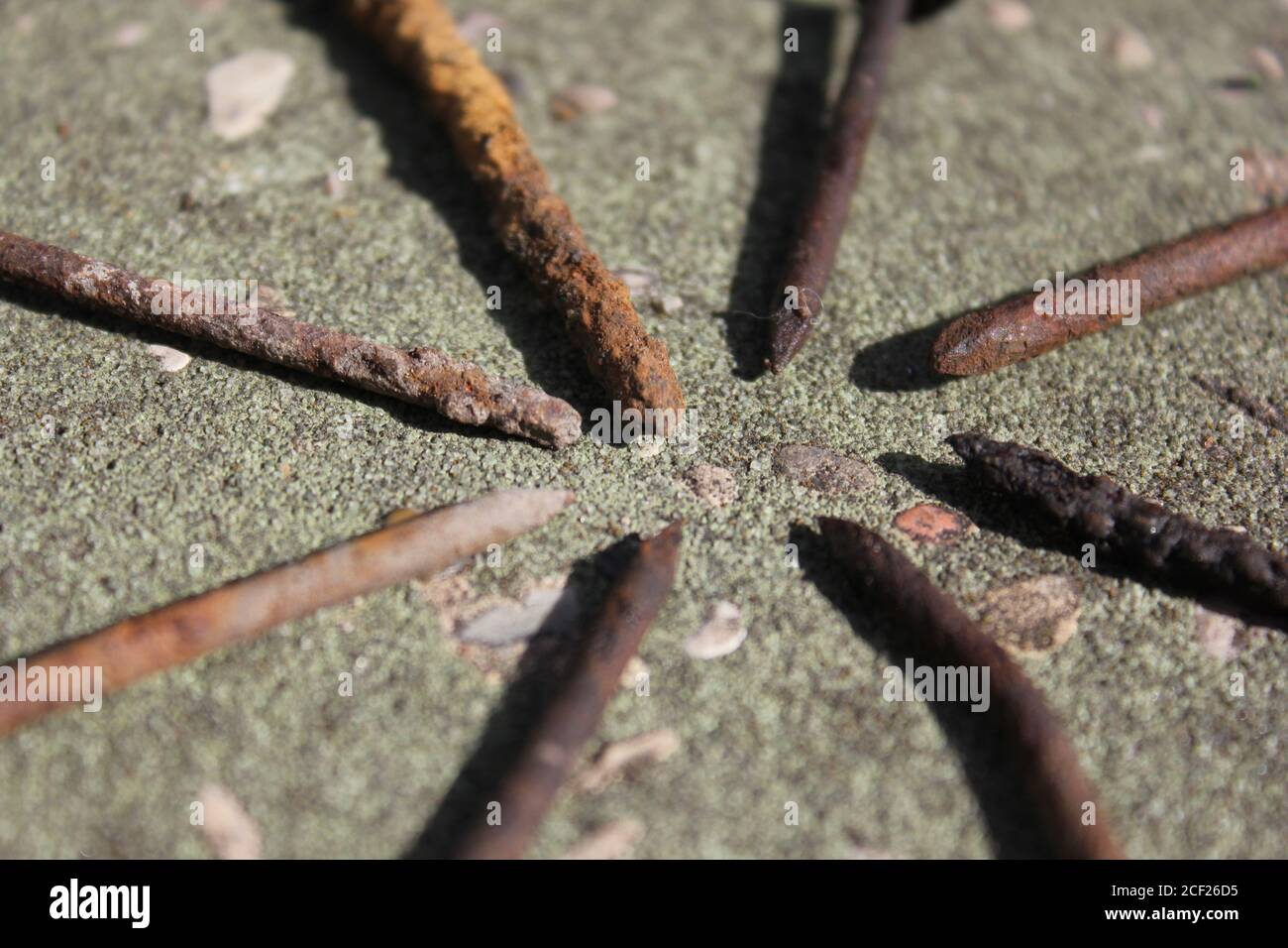 A pile of rusted nails laying on the ground Stock Photo - Alamy