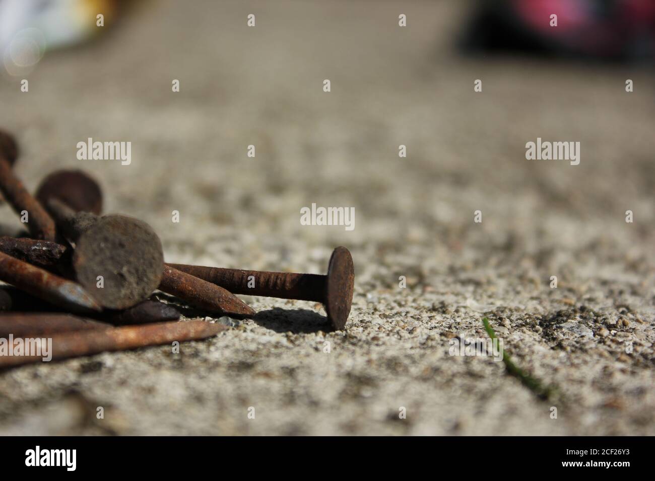 A pile of rusted nails laying on the ground Stock Photo - Alamy