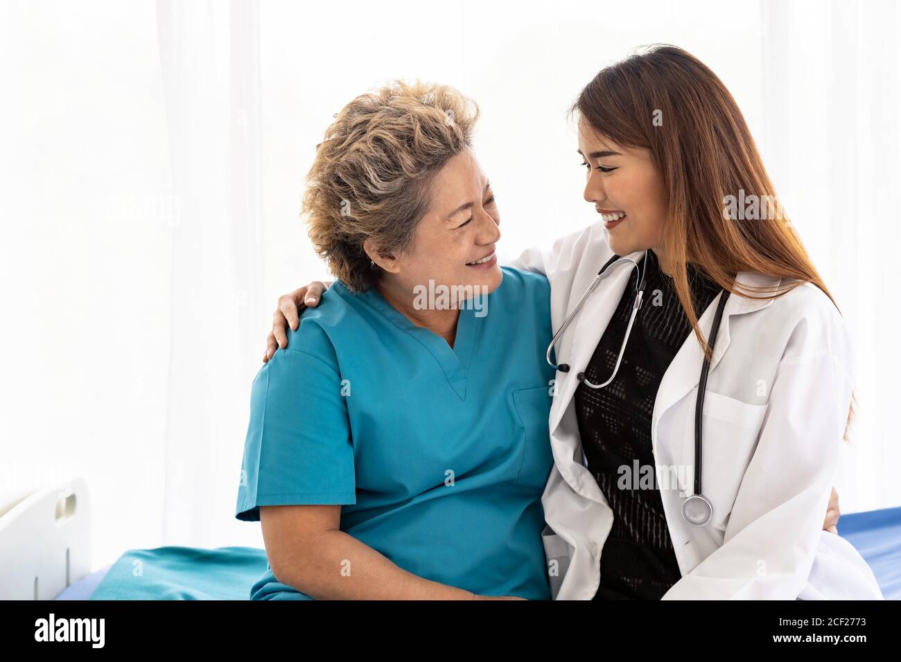 Asian doctor patient hugging hi-res stock photography and images - Alamy