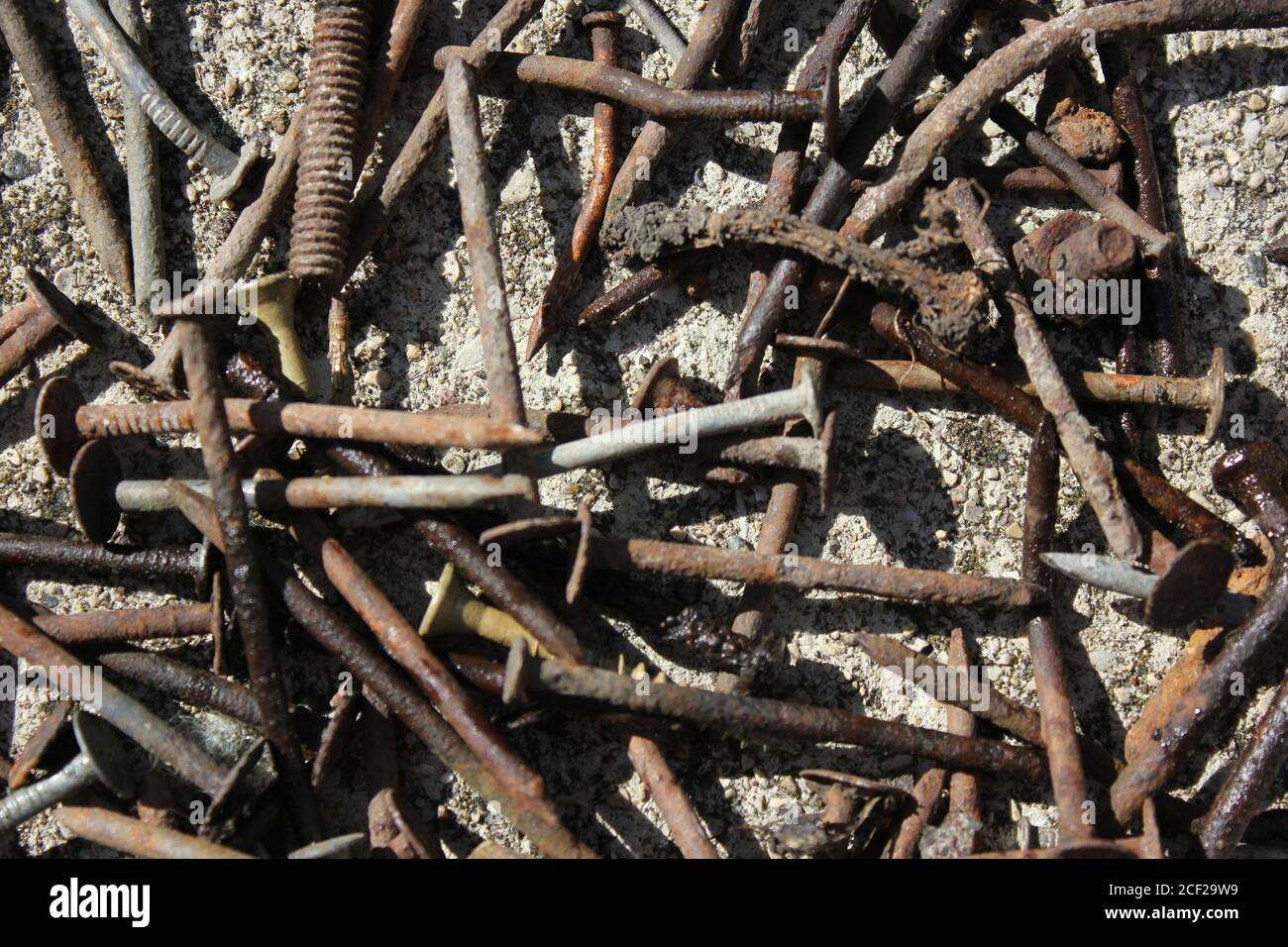 A pile of rusted nails laying on the ground Stock Photo - Alamy