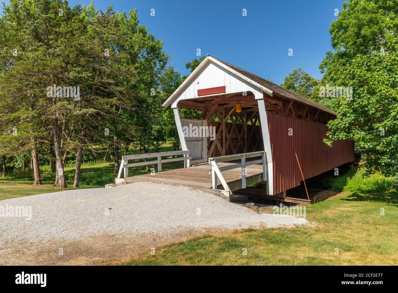 An old red and white covered bridge Stock Photo - Alamy