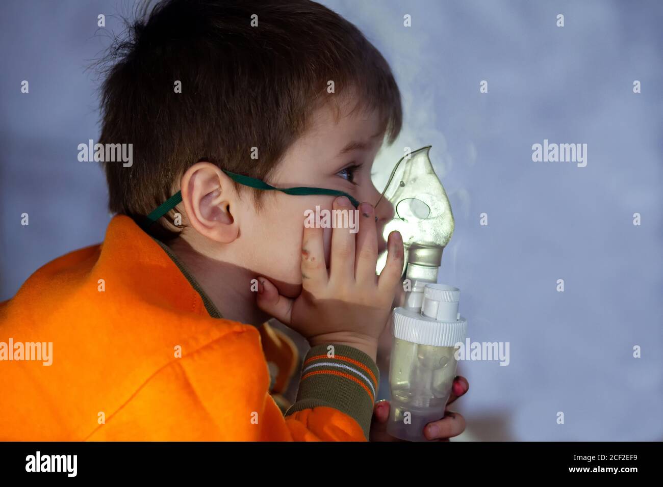 Little boy in a mask, treatments respiratory tract with a nebulizer at ...