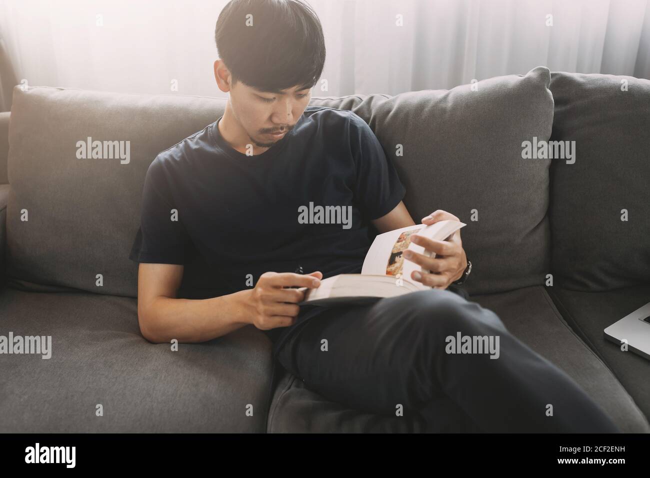 Indian man reading book on hi-res stock photography and images - Alamy