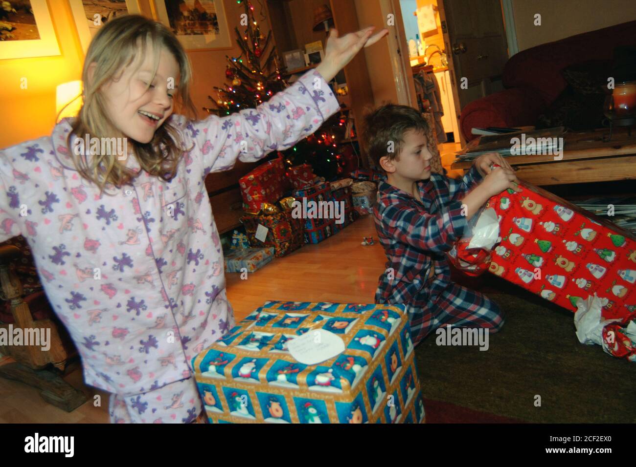 Children opening Christmas presents on Christmas Day morning; UK Stock ...