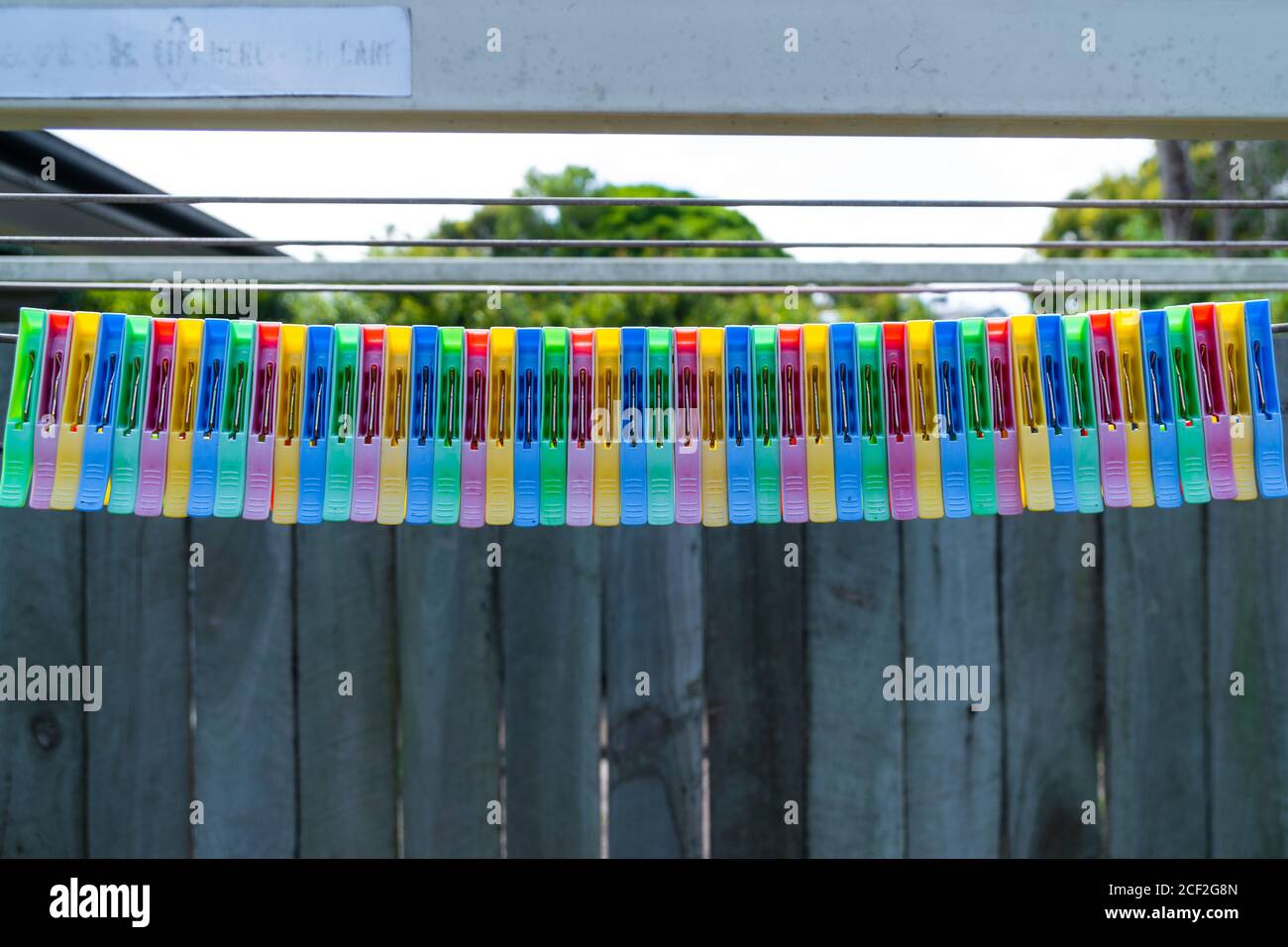 Colourful pegs on a washing line Stock Photo - Alamy