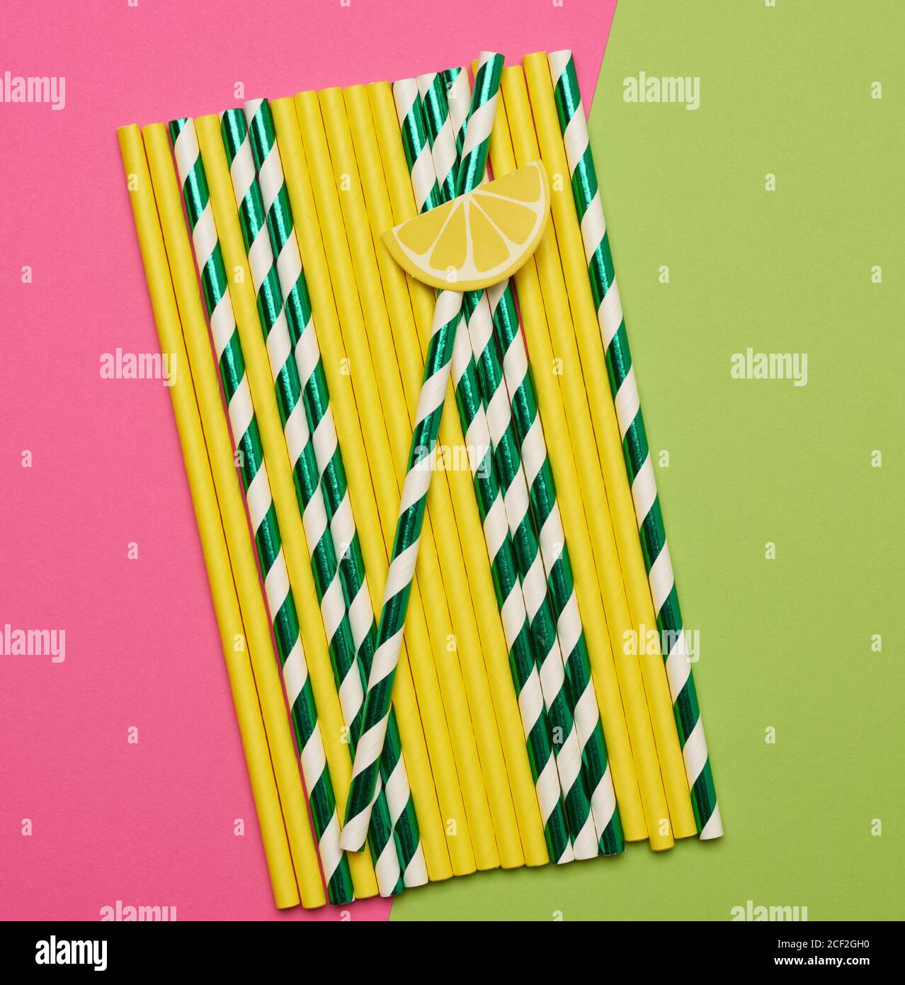 paper cocktail tubes on a green pink background, rejection of plastic ...