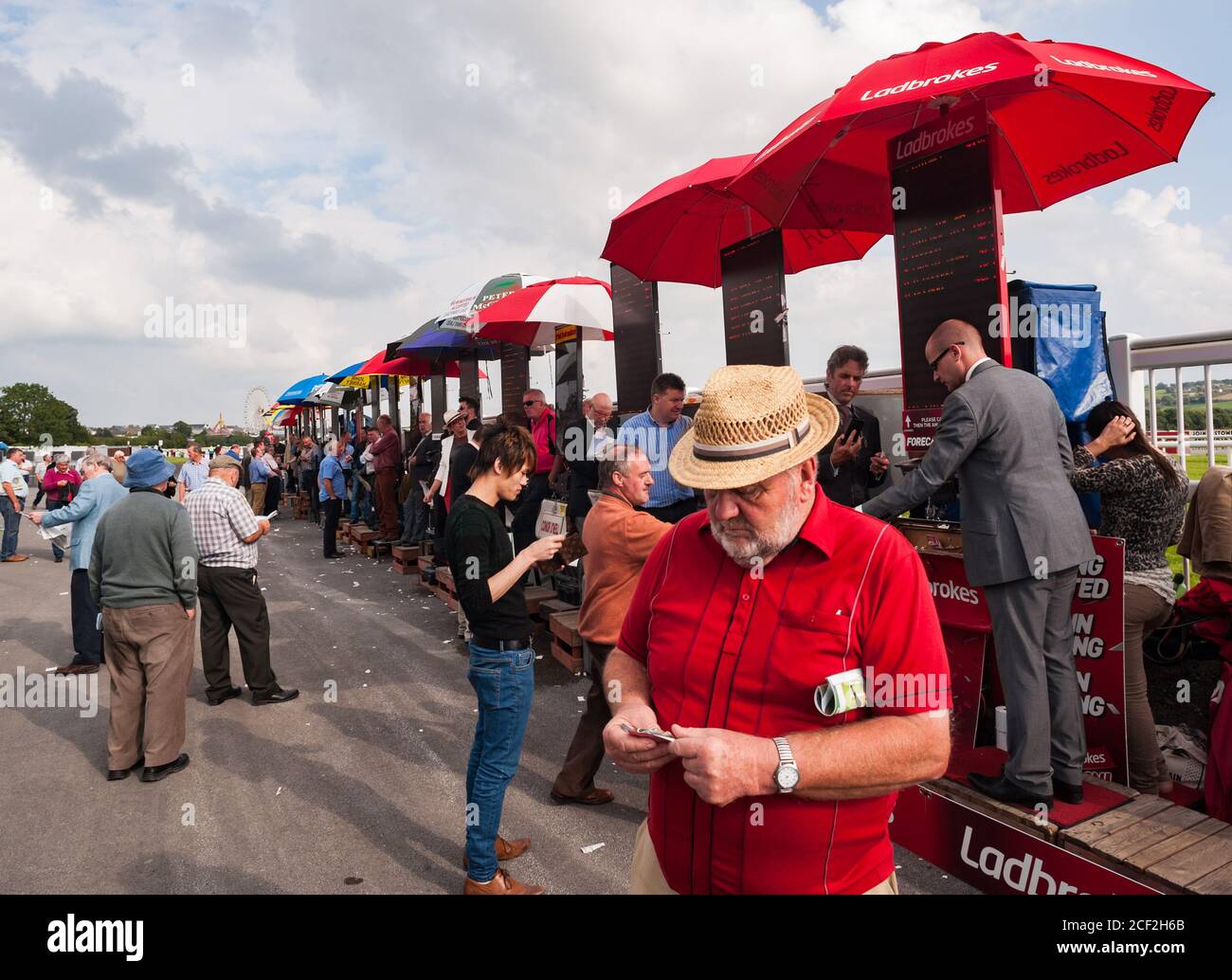 Listowel, Ireland - 15th September 2014: Placing bets with Bookies ...