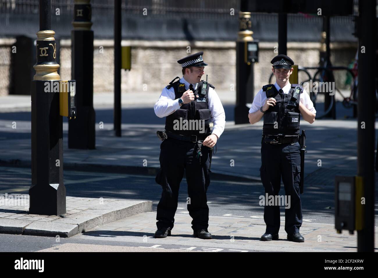 A London Police Officer laughing to his colleague Stock Photo - Alamy