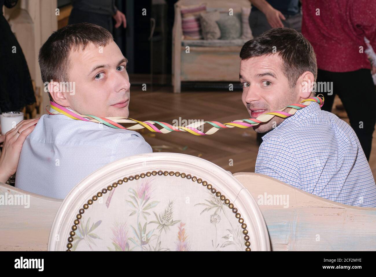 2019, December, Slovakia. Party. Two young guys at a party.New Year's ...