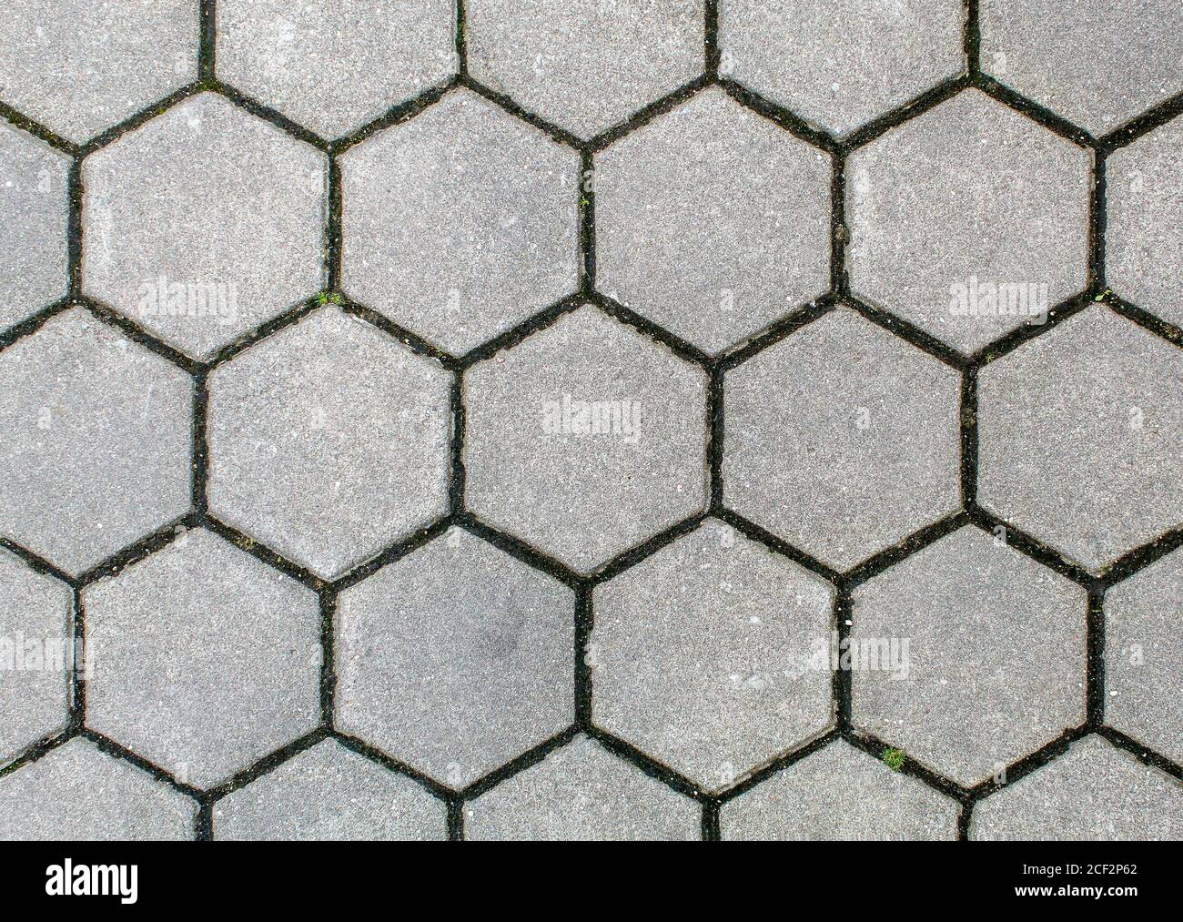 road paved with hexagonal sidewalk tiles. beautiful brick background ...