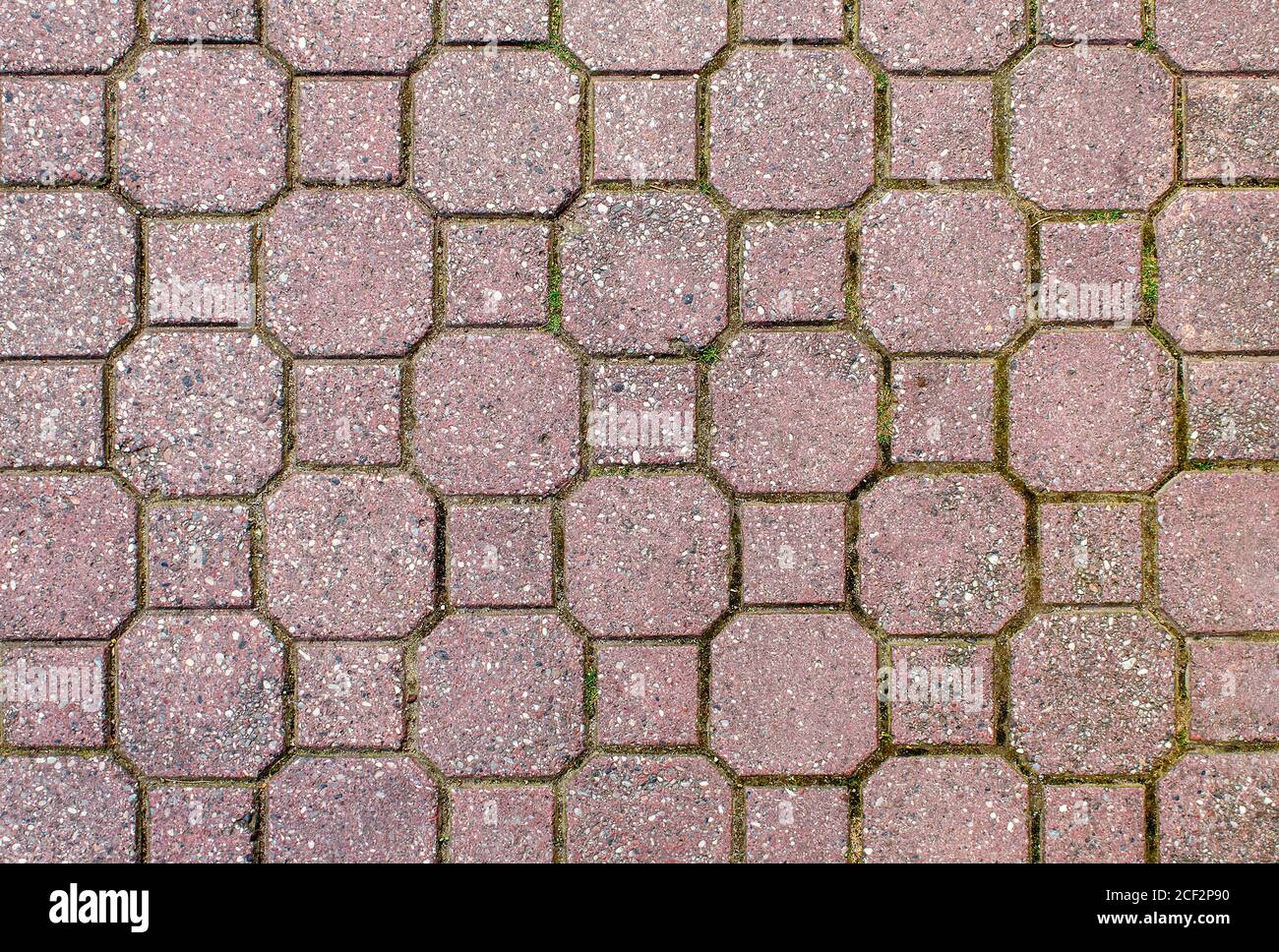 road paved with sidewalk tiles. beautiful brick background with ...
