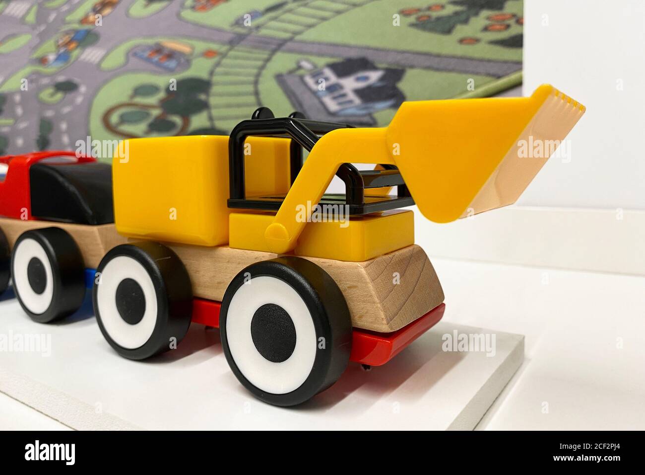 yellow and red toy car bulldozer with a bucket made of plastic and wood ...