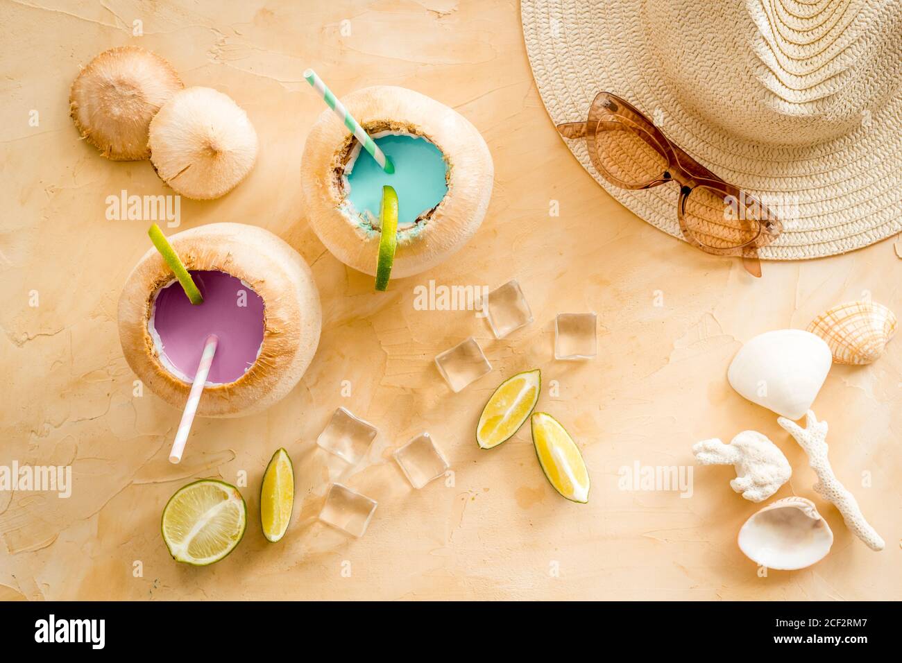 Tropical coconut drink with straw on beach background, top view Stock ...