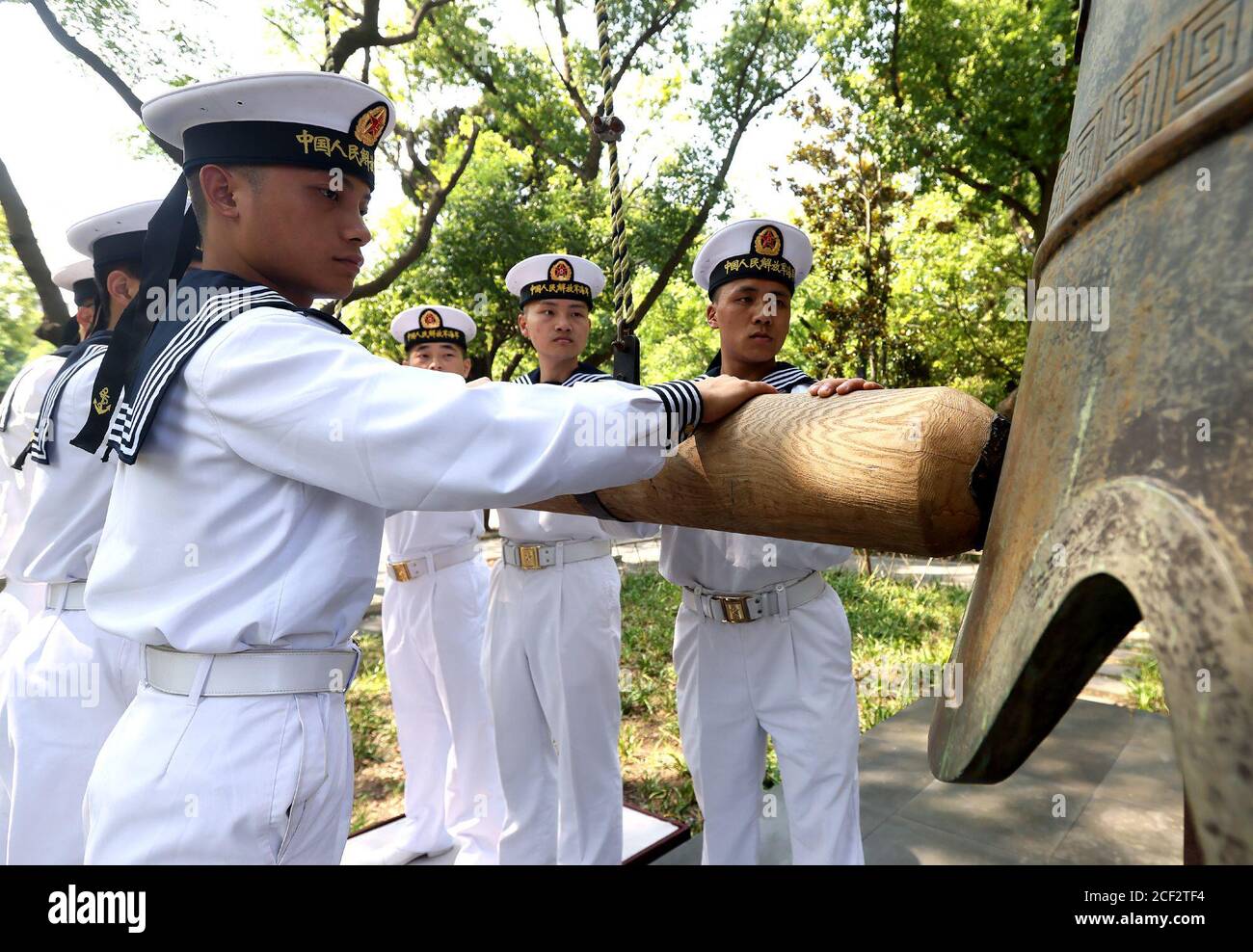 Shanghai, China. 3rd Sep, 2020. Soldiers strike the bell during a ...