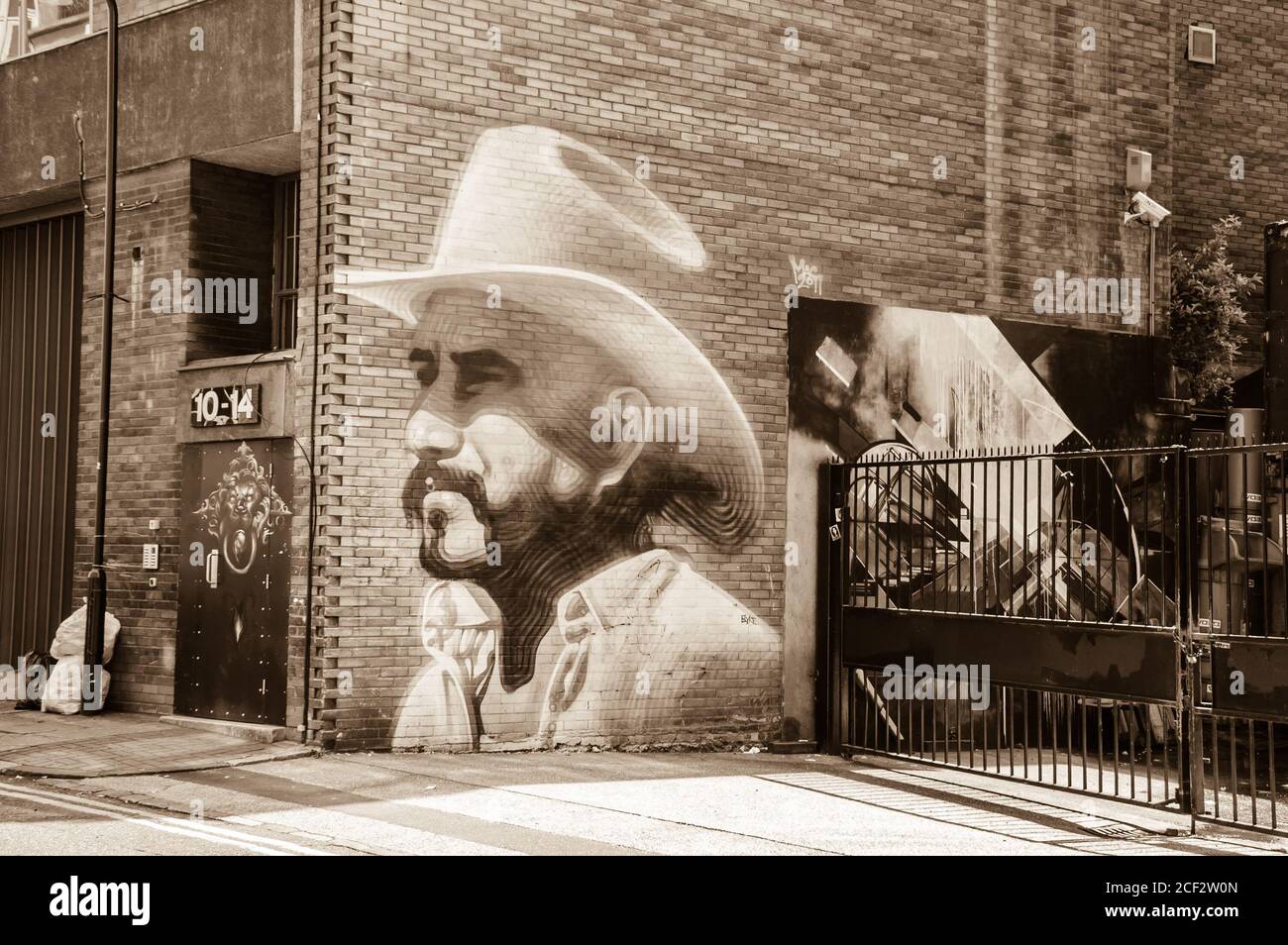 LONDON, ENGLAND, UK - MAY 4, 2014: Cowboy graffiti on the wall at the ...