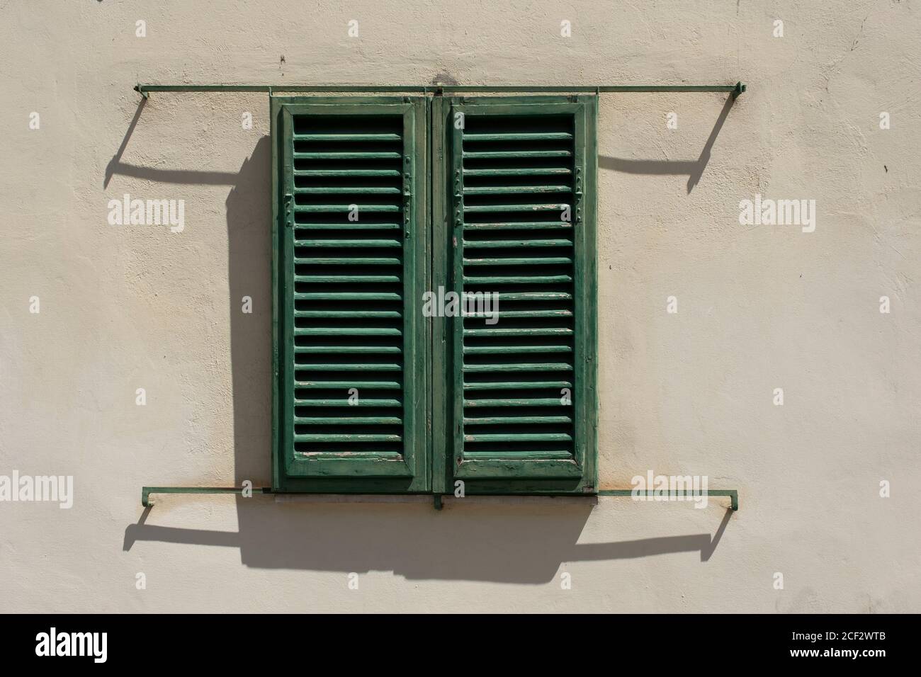 Italian Window with Wooden Shutters in a brick wall Stock Photo - Alamy