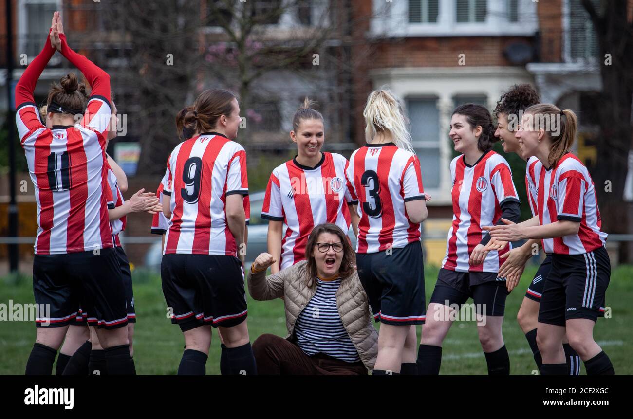 Clapton CFC hold a team circle before a match. 14th March, 2020 Stock ...
