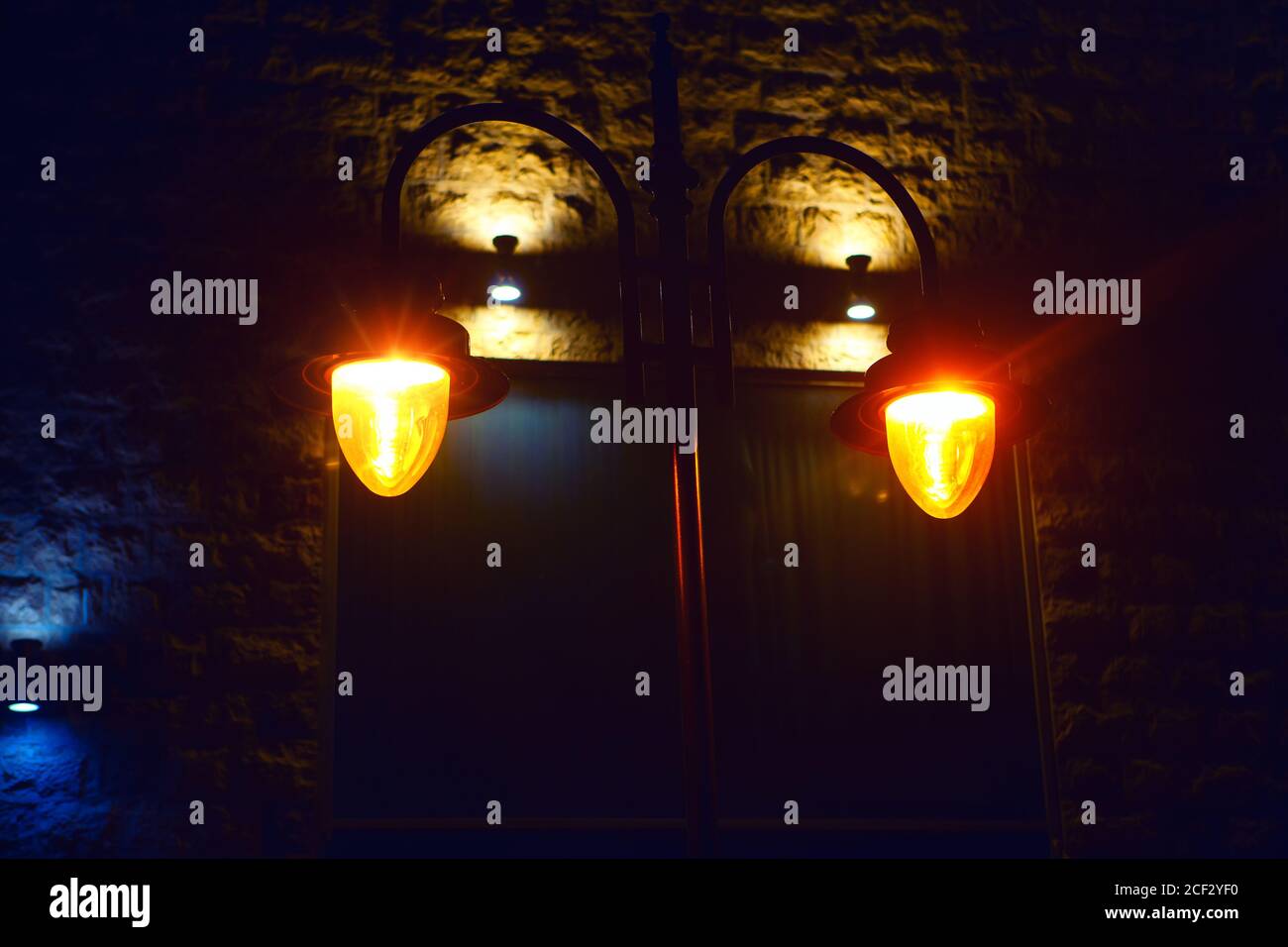 Old street lamp light . Medieval town illuminated in the night Stock ...