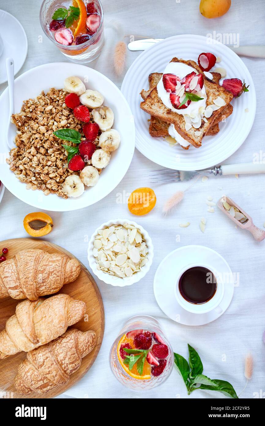 Fresh and bright continental breakfast table, abundance healthy meal ...