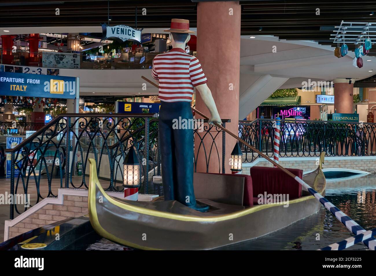 Terminal 21 interior. Statue of a Venetian gondolier with traditional ...
