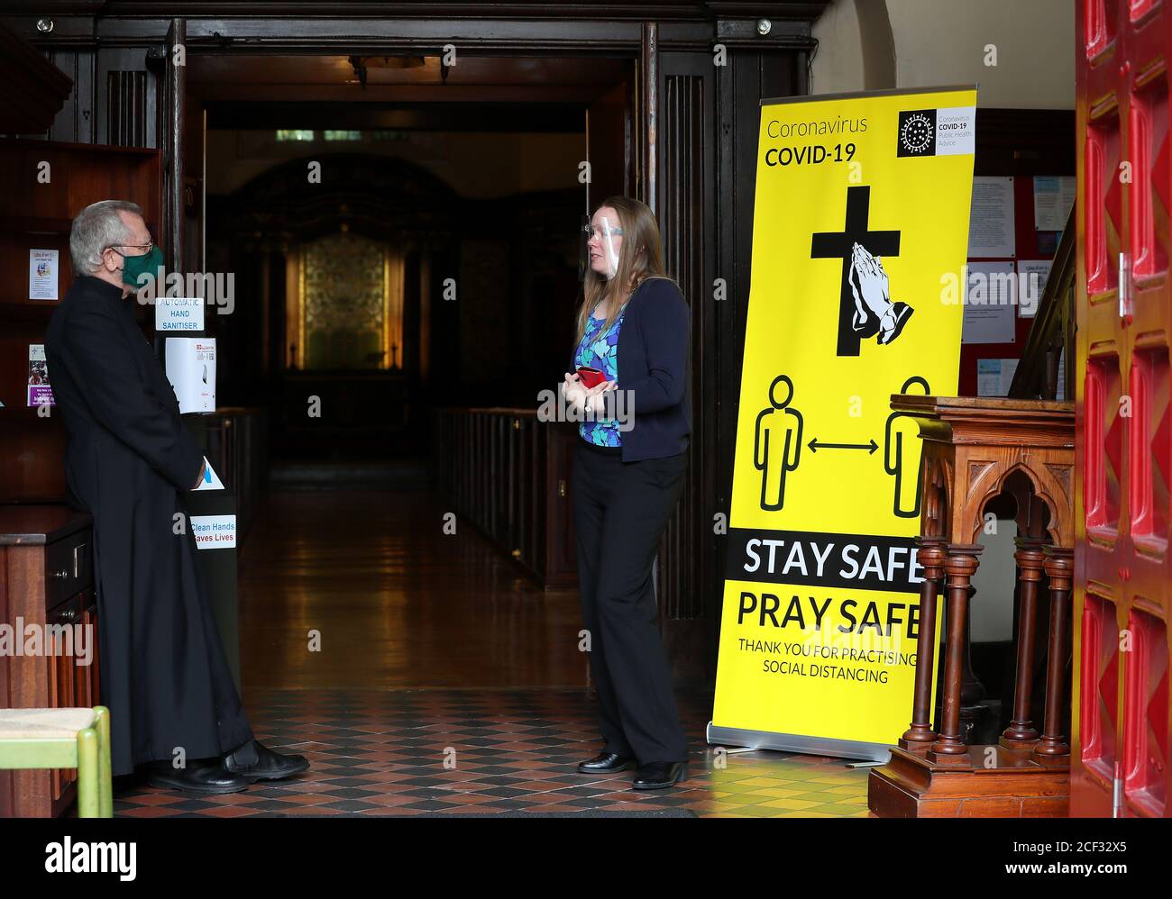 Church warden Susie Harrison (right) in conversation with church verger ...