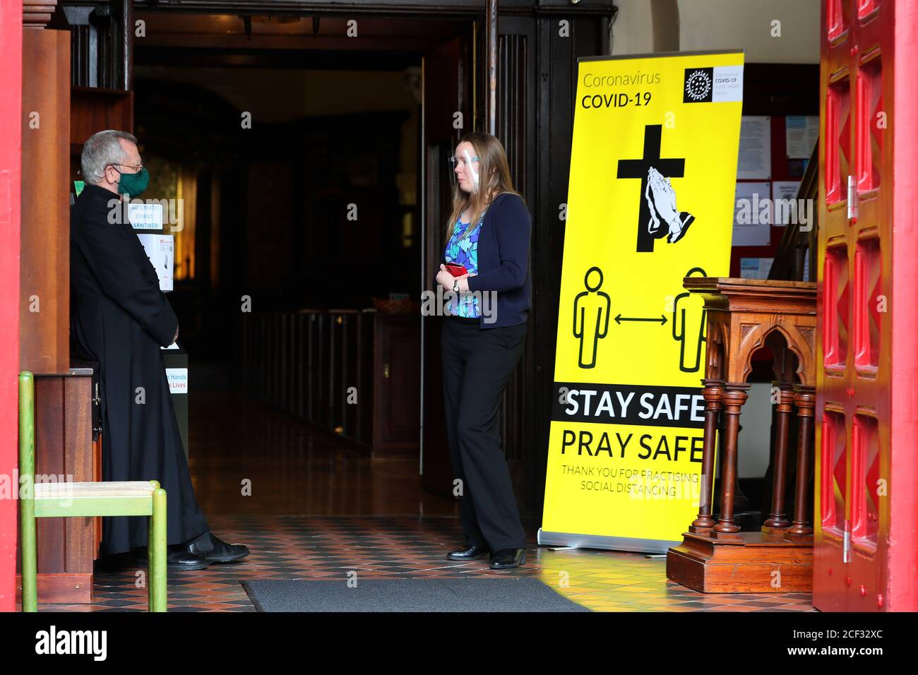 Church warden Susie Harrison (right) in conversation with church verger ...