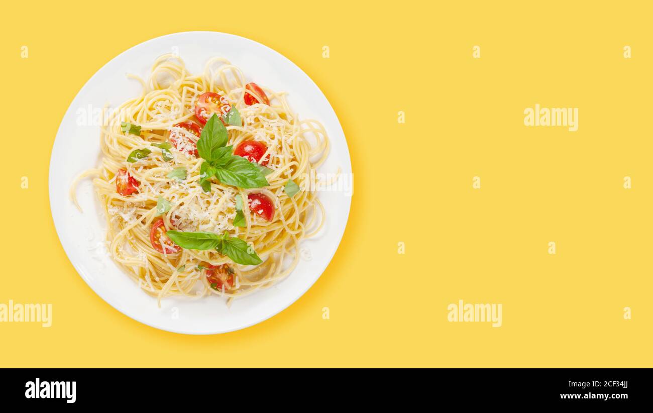 Spaghetti pasta with tomatoes and basil. Top view flat lay with copy ...