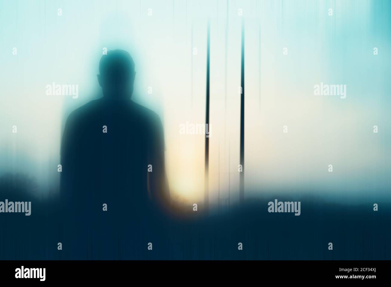 A mysterious male figure, silhouetted by the sun. With a blurred, out ...
