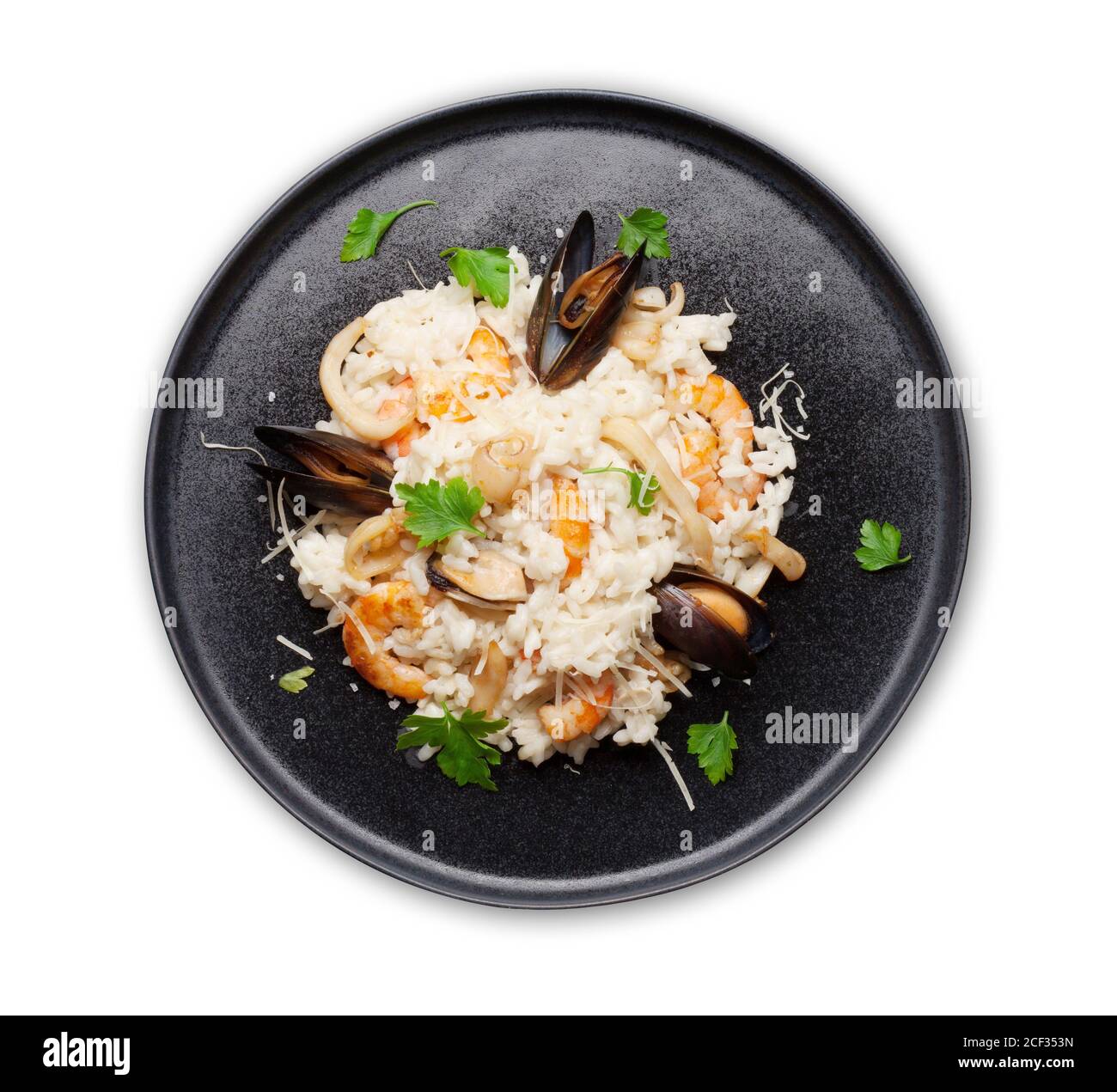 Delicious seafood risotto with shrimps, prawns, mussels. Dressed with ...