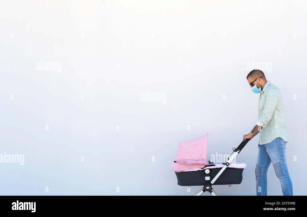father walking with his baby's stroller Stock Photo - Alamy