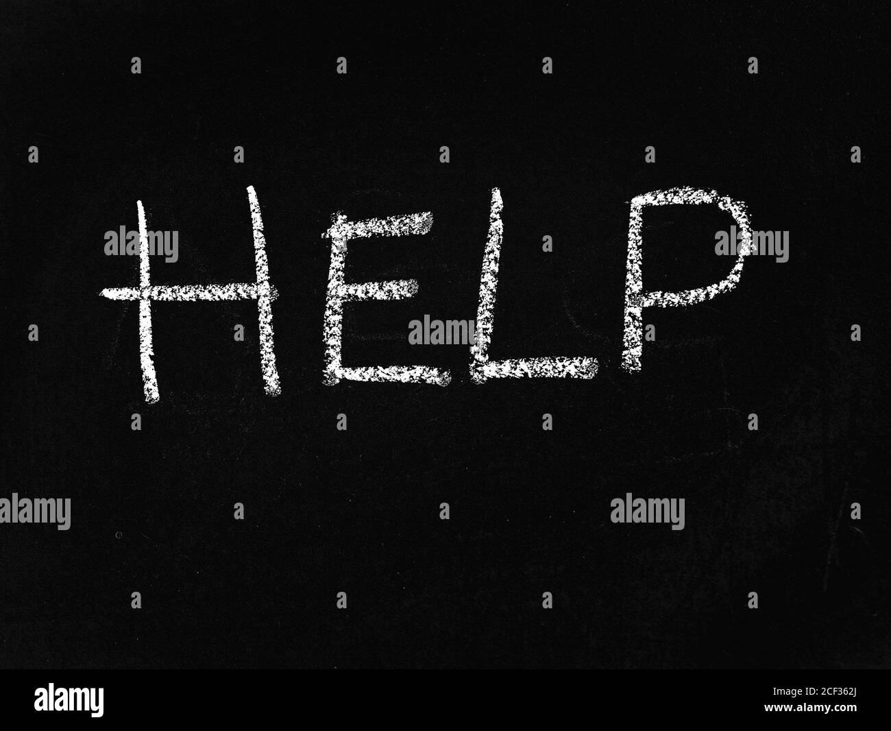 Help written on a chalkboard Stock Photo - Alamy