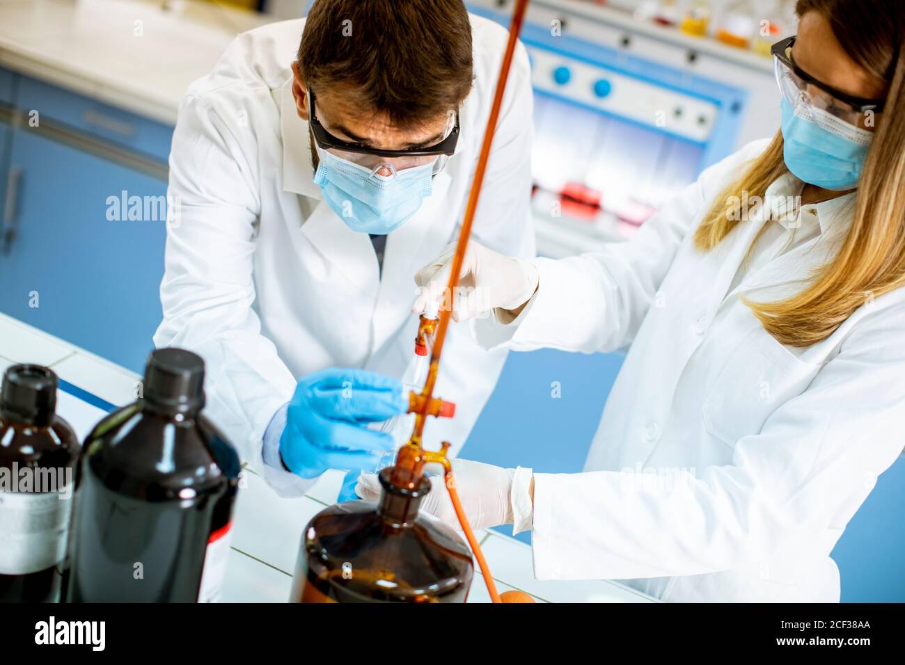 Young researchers analyzing chemical data in the laboratory Stock Photo ...