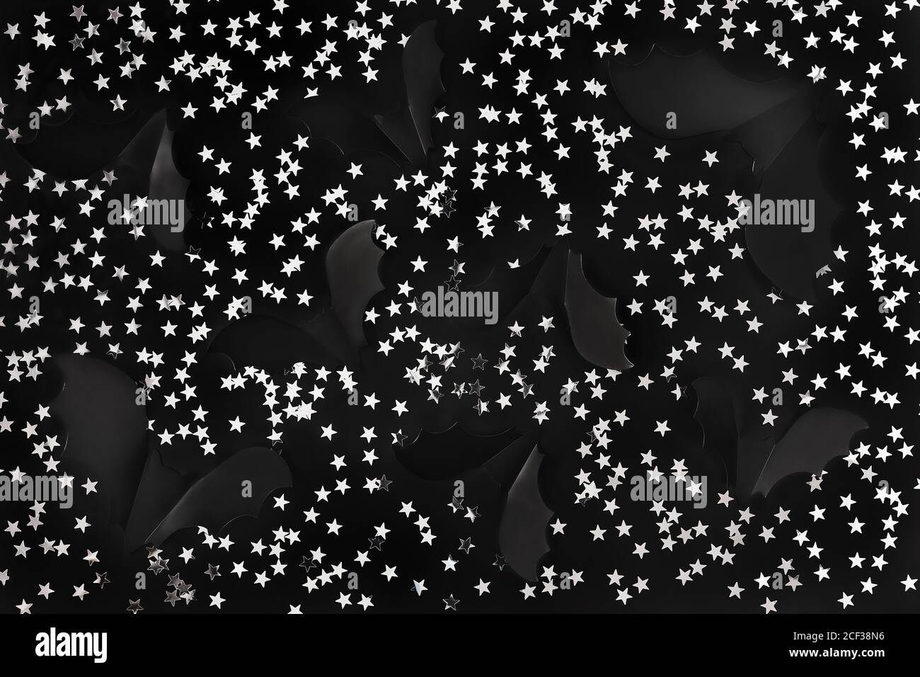 Cartoon Halloween background black bats and silver star shaped confetti ...
