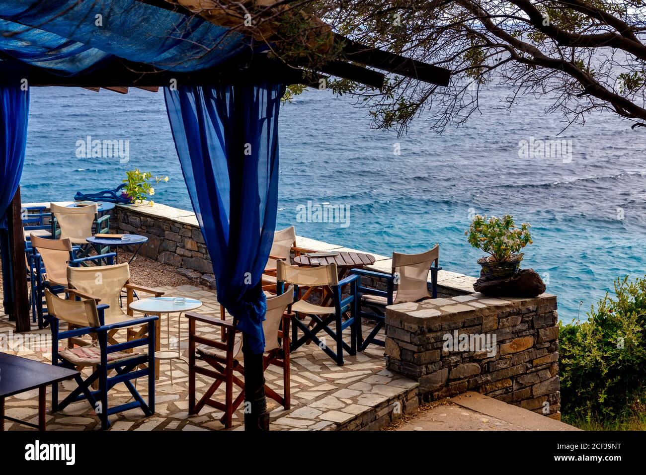 Traditional greek cafe in pelion. cafe near seaside. table and chair ...