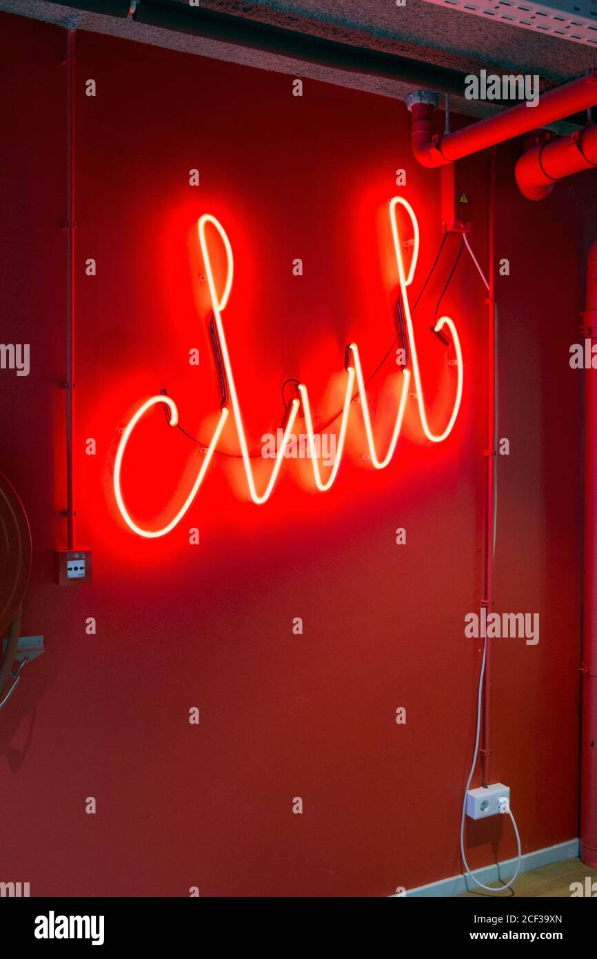"Club" red sign with neon light on a wall Stock Photo - Alamy