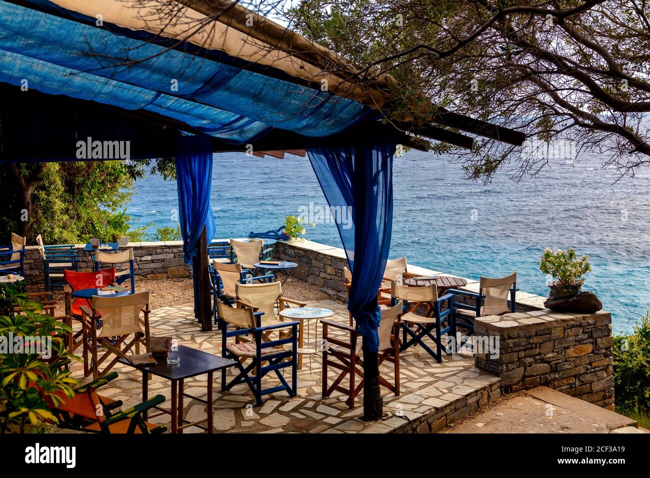 Traditional greek cafe in pelion. cafe near seaside. table and chair ...