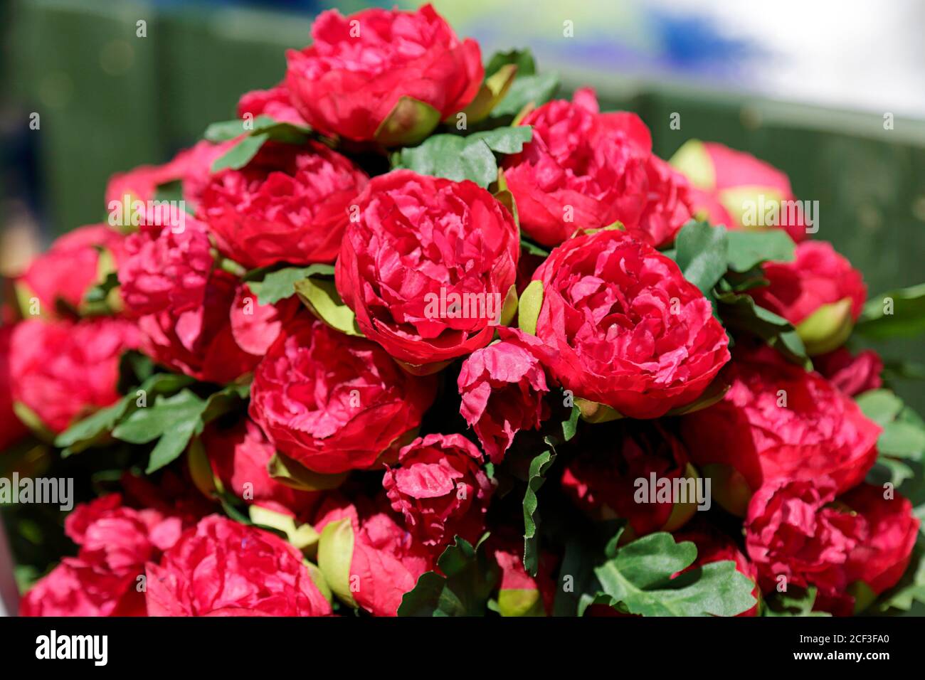 Artificial red roses bouquet for sale Stock Photo - Alamy