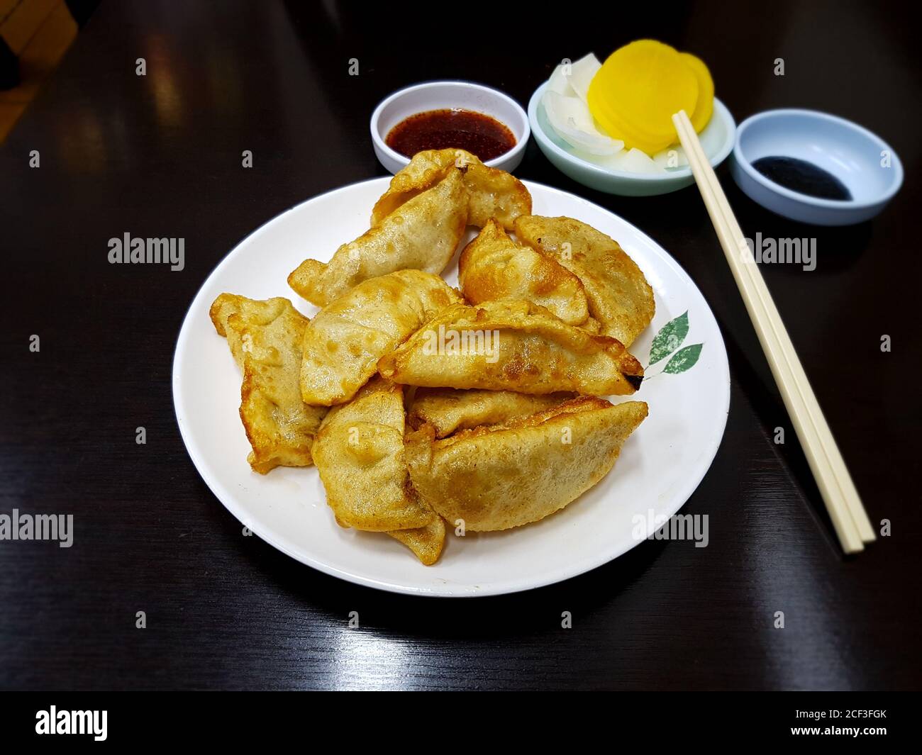 Gun-mandu, Korean style pan-fried dumpling. Pieces of dough wrapped ...