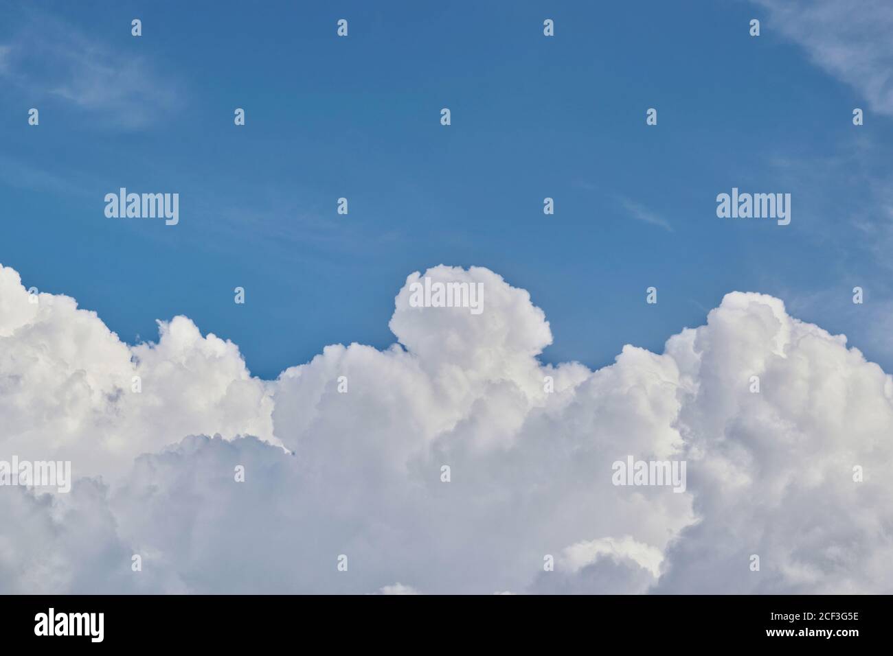 Cumulus clouds forming in the sky before the onset of a thunderstorm in ...