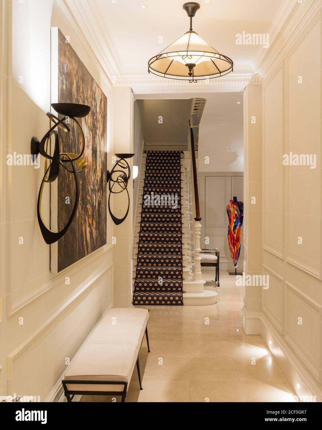 Lit lights in hallway by staircase Stock Photo - Alamy