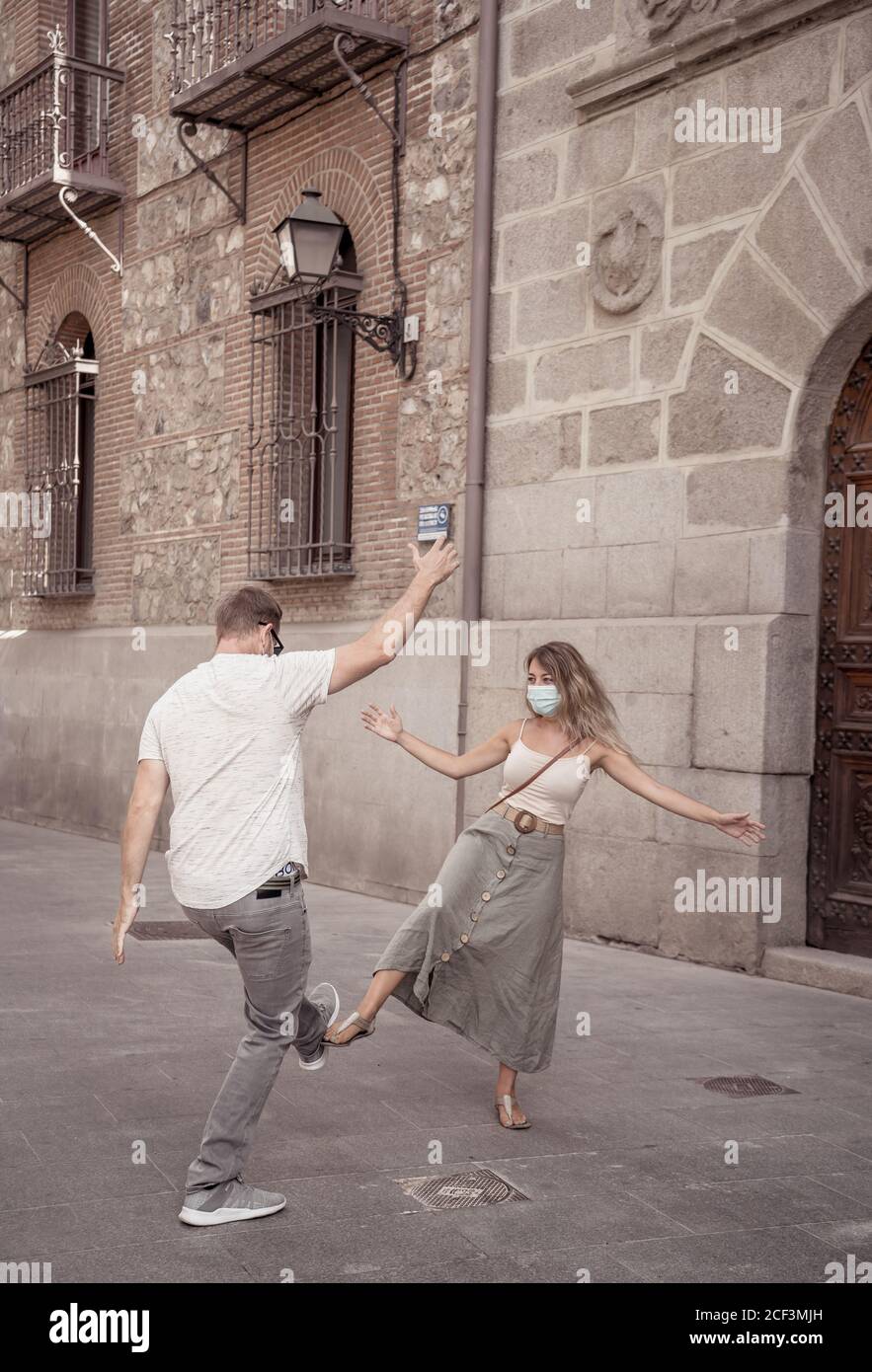 Safer way of greeting in the New Normal. Man and woman foot shaking and ...