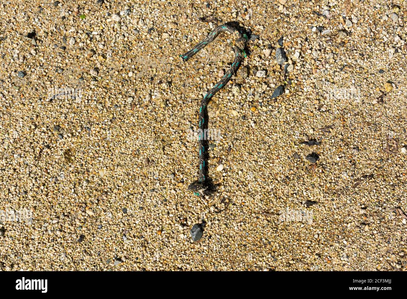 An old piece of rope in the shape of a question mark on a beach Stock ...